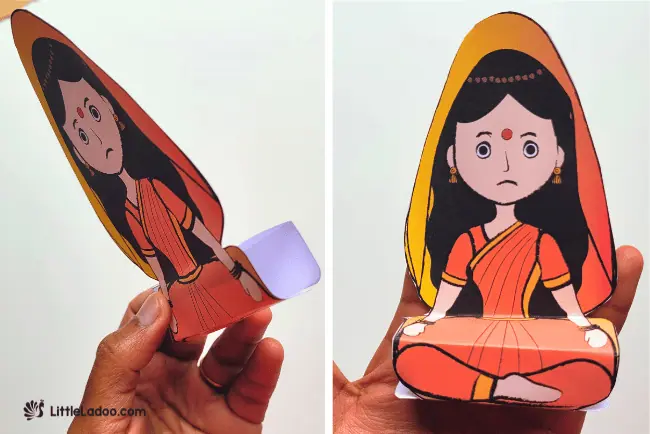 The Story of Holi Craft - Holika and Prahlad sitting on a Pyre