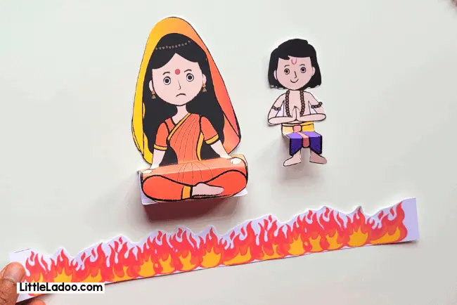 The Story of Holi Craft - Holika and Prahlad sitting on a Pyre
